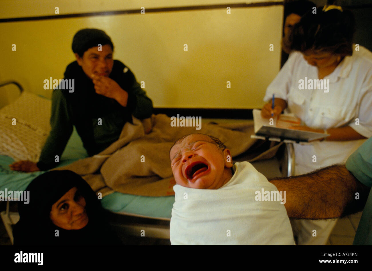 A male nurse holds Suha Abu Alpha the first baby born in Jericho on ...