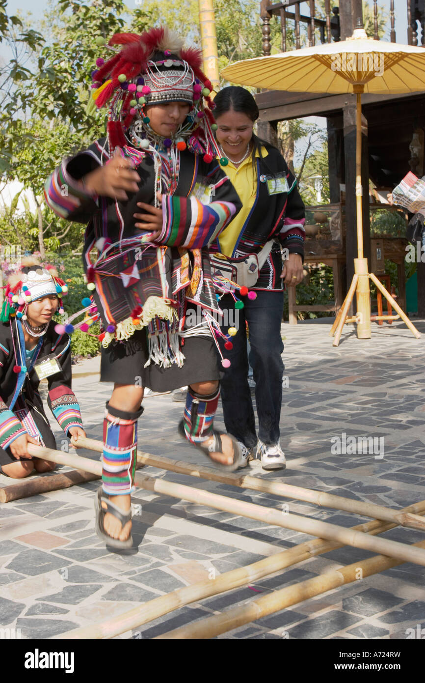 Young girls in Akha tribe traditional costumes dancing. Chiang Mai ...