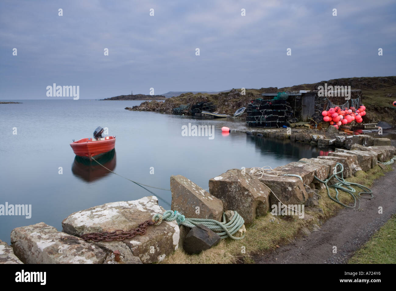 Small red boat in calm water Croig Pier Mull Scotland Stock Photo - Alamy