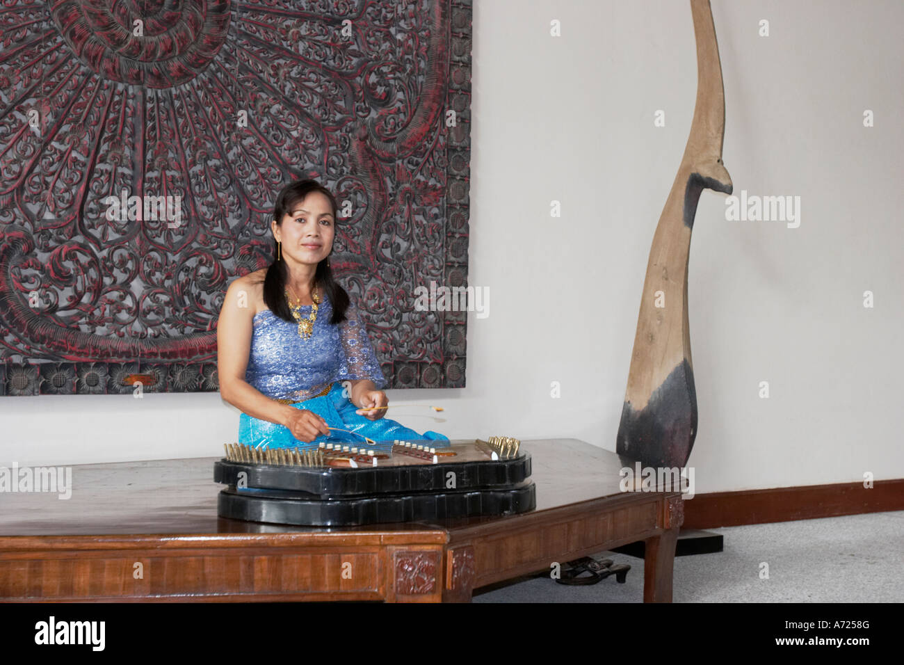 Woman playing khim, traditional Thai musical instrument. Phuket ...