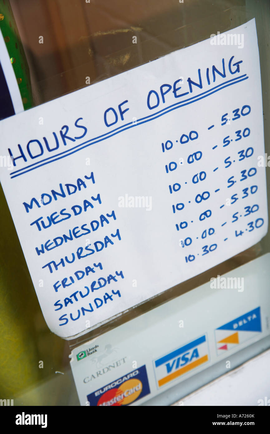 Hours of Opening Sign in Shop Window Stock Photo - Alamy