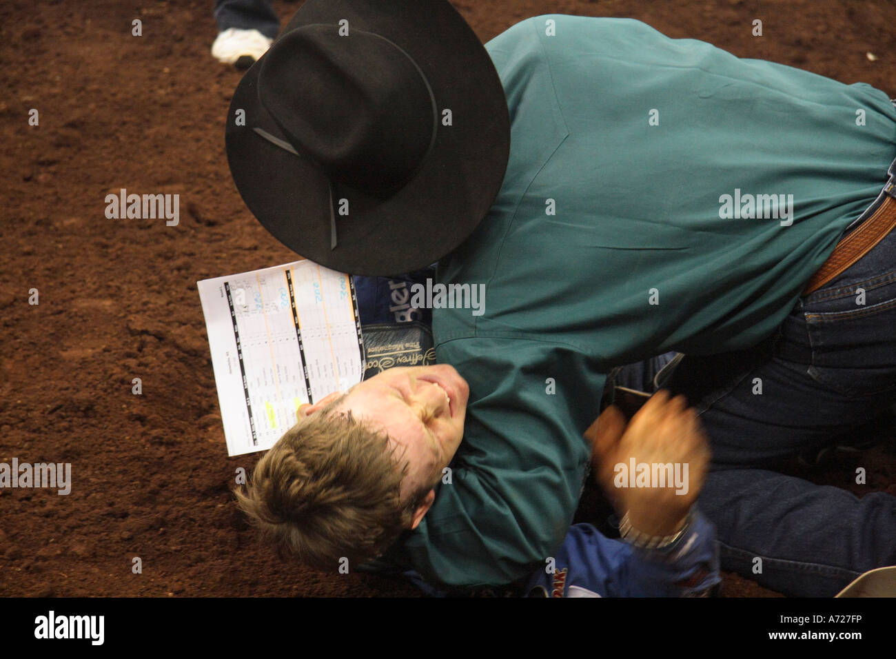 Professional bullrider Chris Shivers in agony after a bull steps on his ...