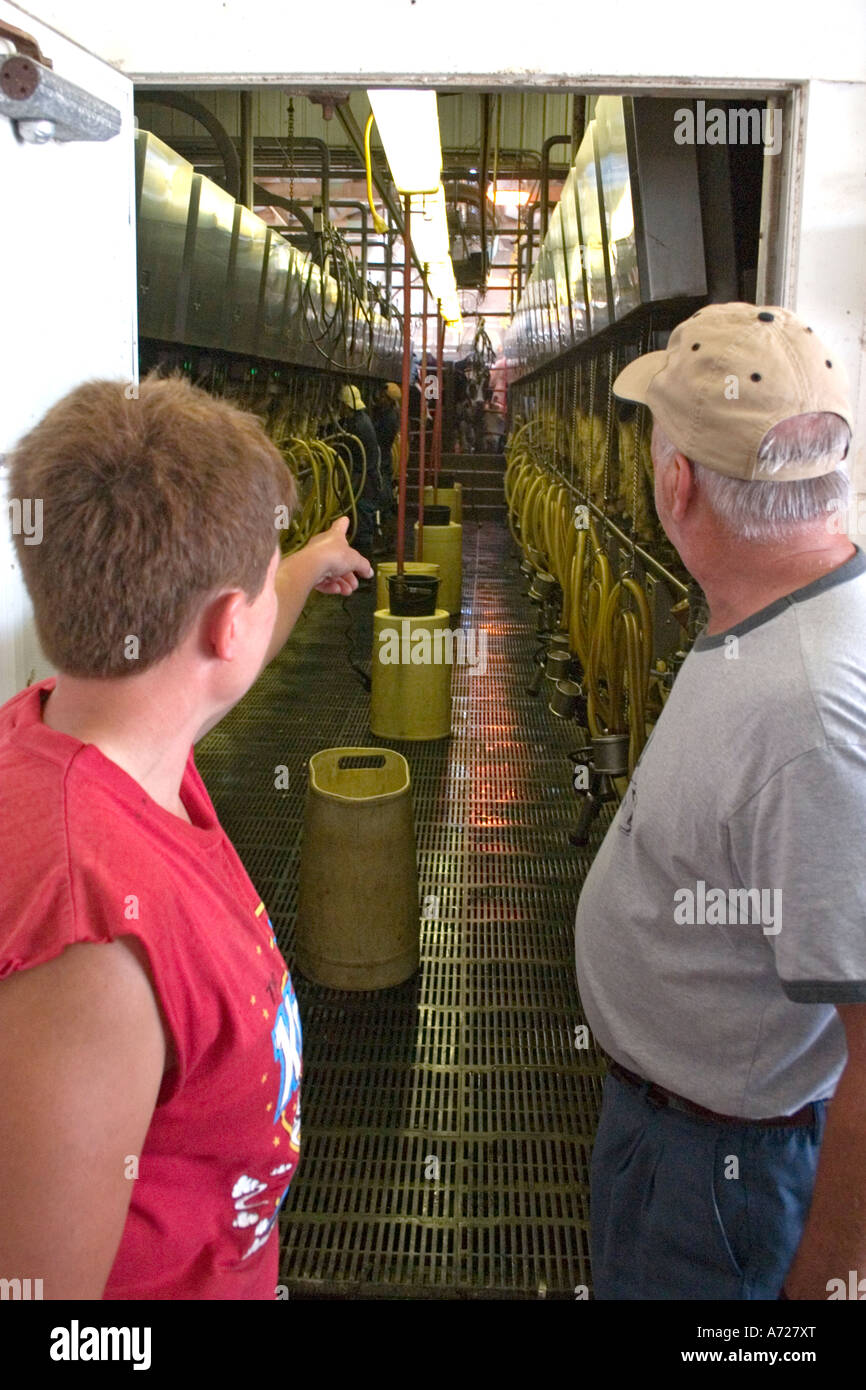 Tour guide showing the automated cow milking barn. Abel Dairy Farms ...