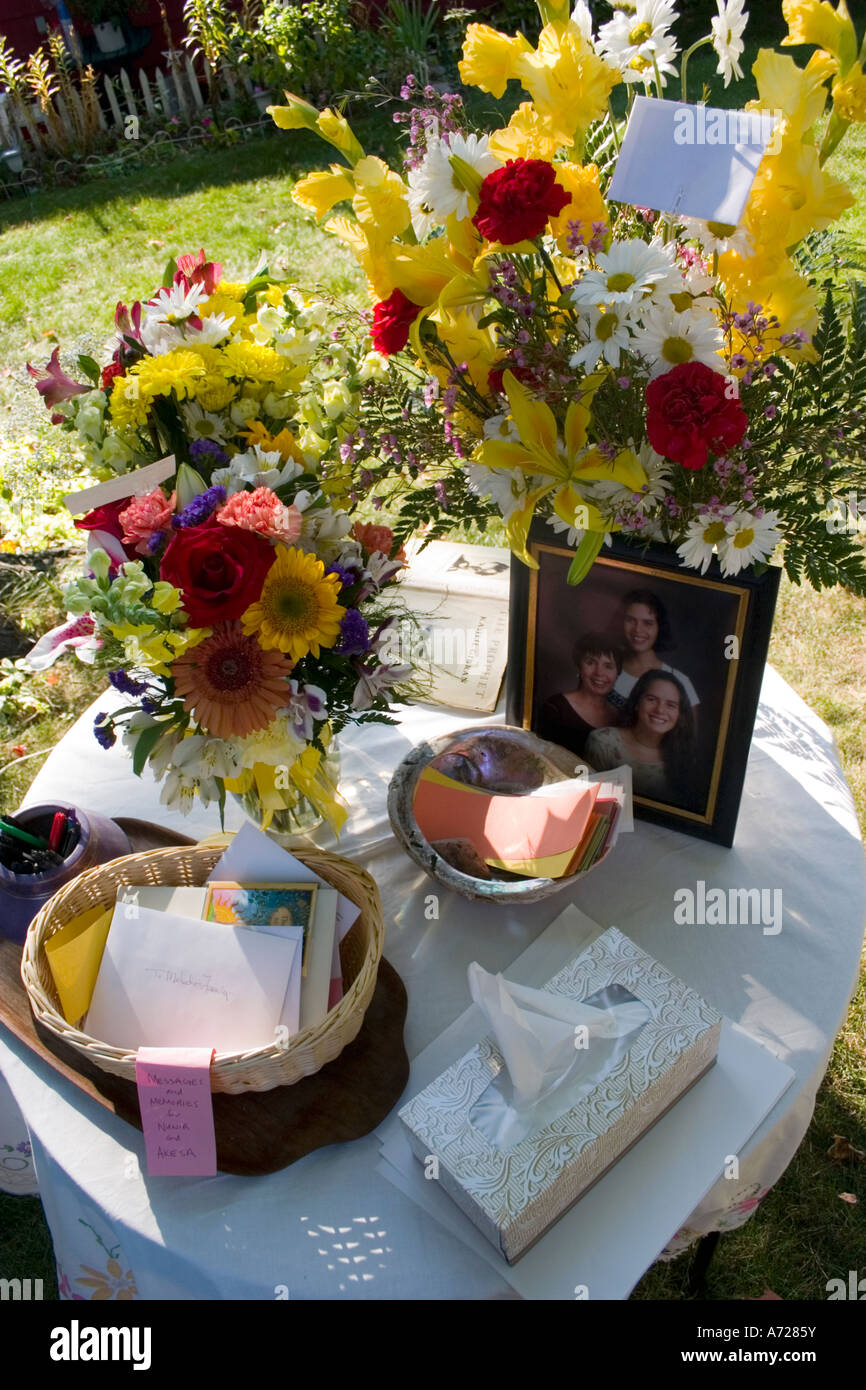Memorial service table with bouquets photo and cards. McKinley ...