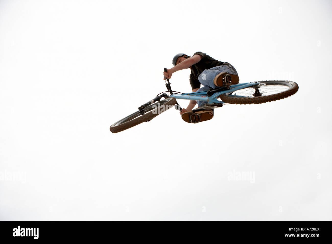 Mountain biking Mountain biker jumping high Stock Photo - Alamy