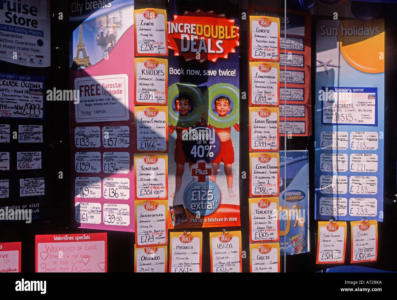 Shop window display in travel agents shop Stock Photo - Alamy