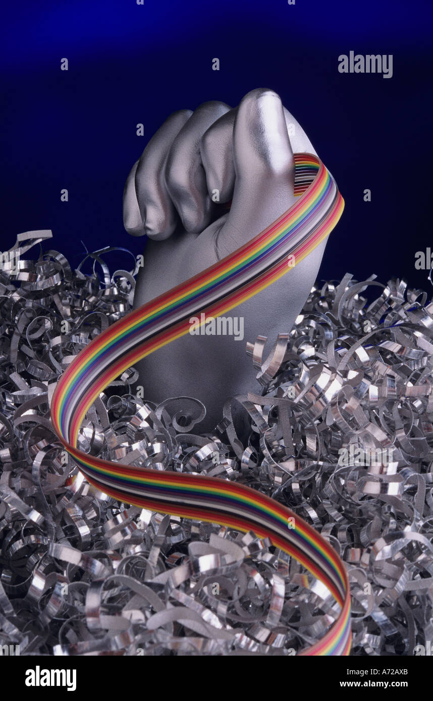 Silver hand holding computer cable Stock Photo - Alamy