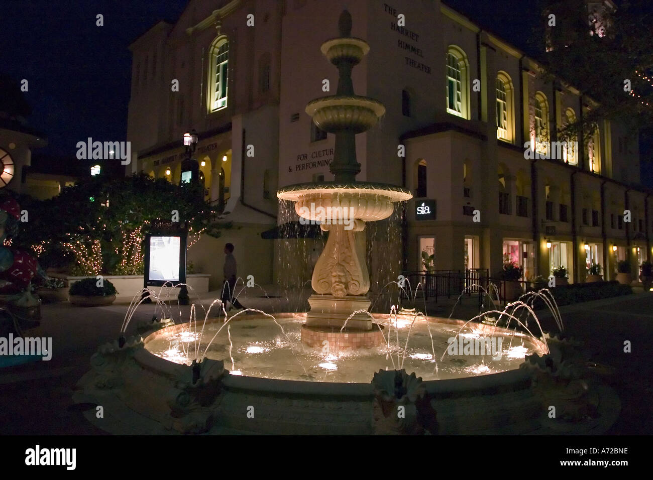 Illuminated fountain at night with Harriet Himmel Gilman Theater in ... Illuminated fountain at night with Harriet Himmel Gilman Theater in ...