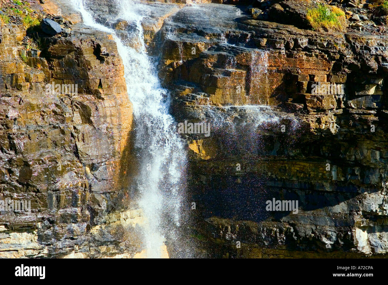 Waterfall cascading over cliff Stock Photo - Alamy