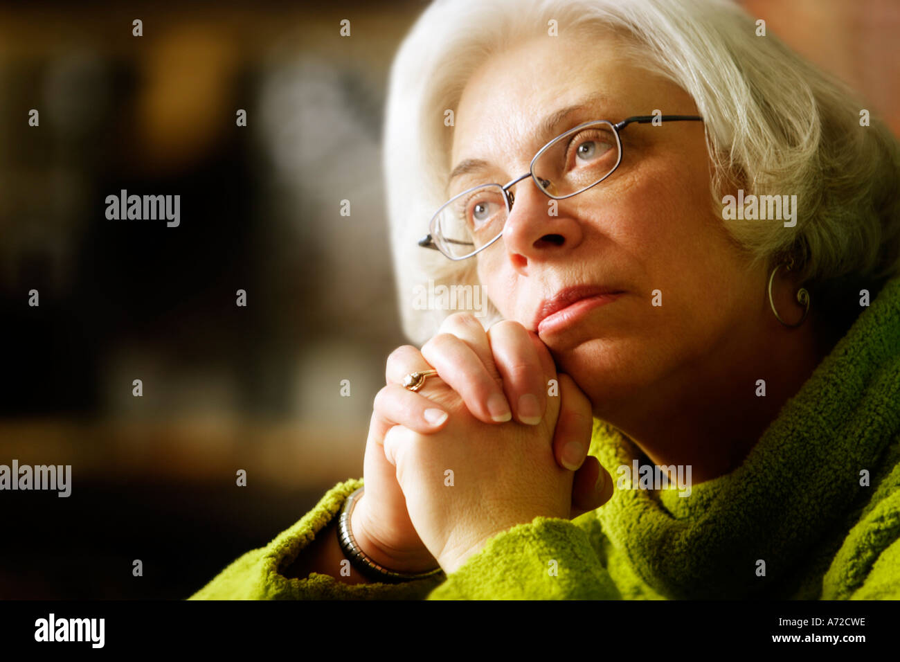 A woman in thought Stock Photo - Alamy
