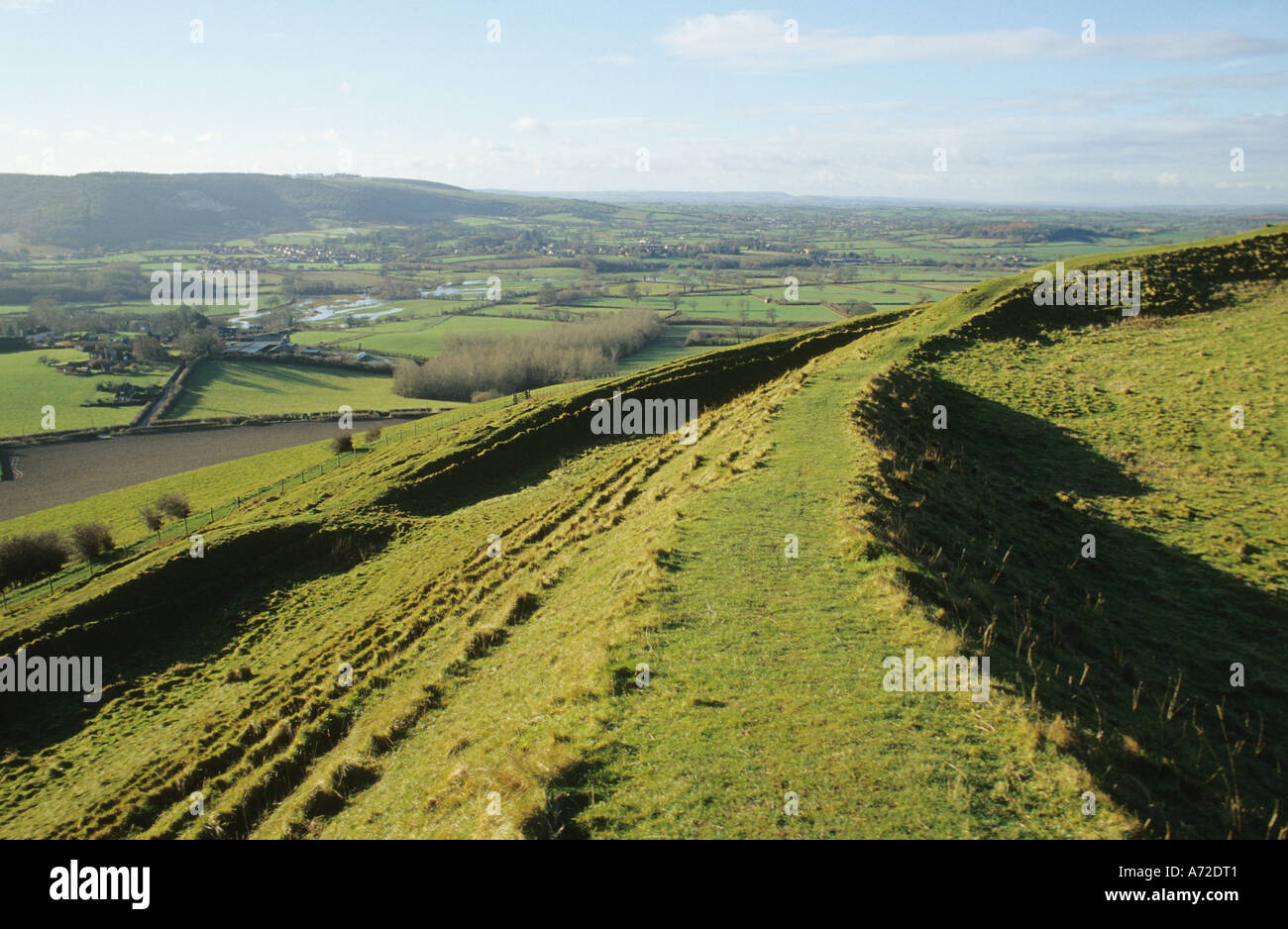 View of the ramparts of the Iron Age hill fort of Hambledon Hill, in ...