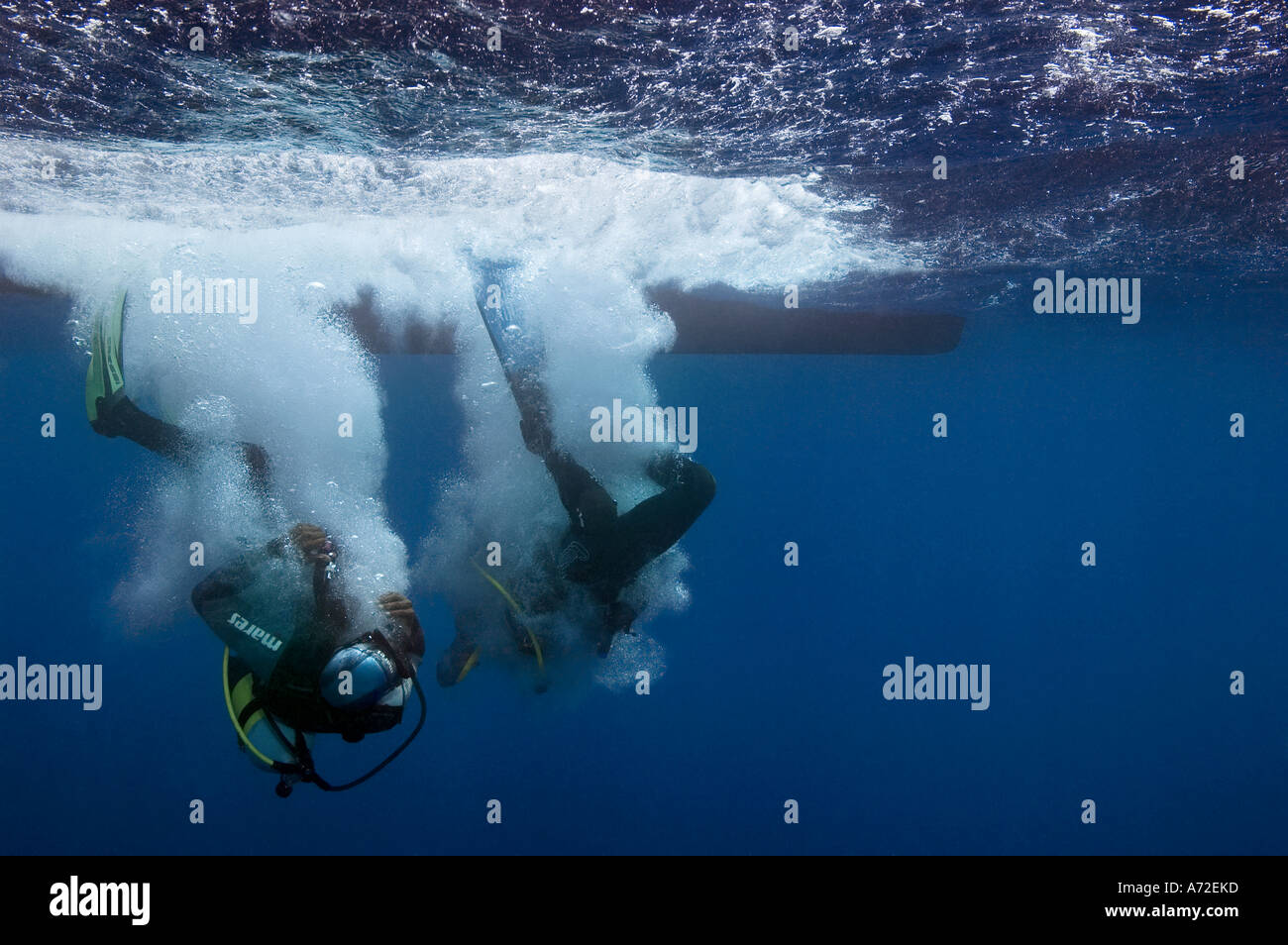 Scuba diver jumping in water hi-res stock photography and images - Alamy