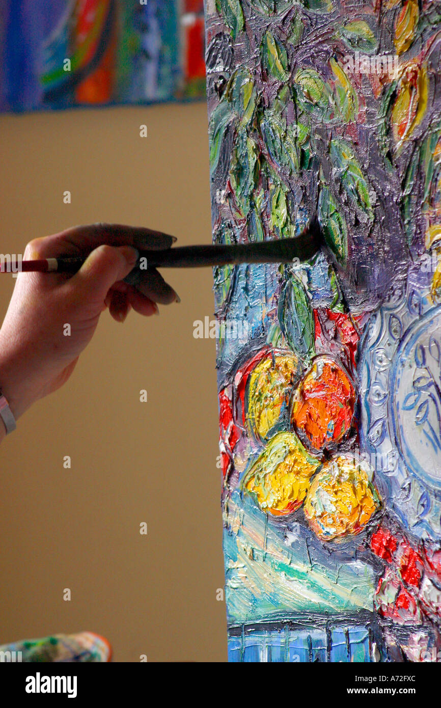 Artist painting at easel Stock Photo - Alamy