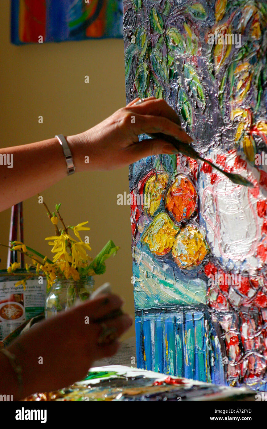 Artist painting at easel Stock Photo - Alamy