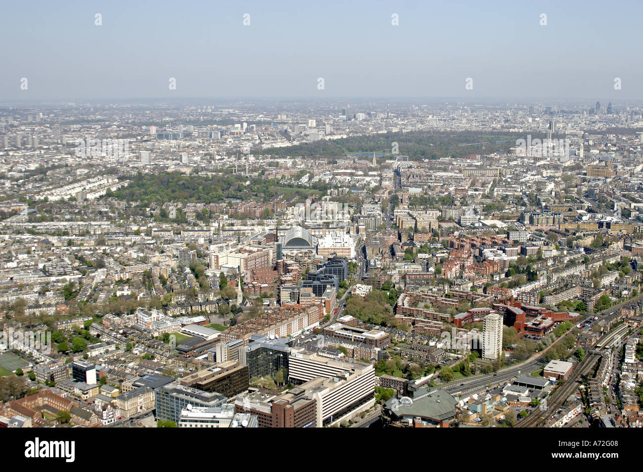 Aerial high level oblique view east of Hammersmith Broadway Olympia and ...