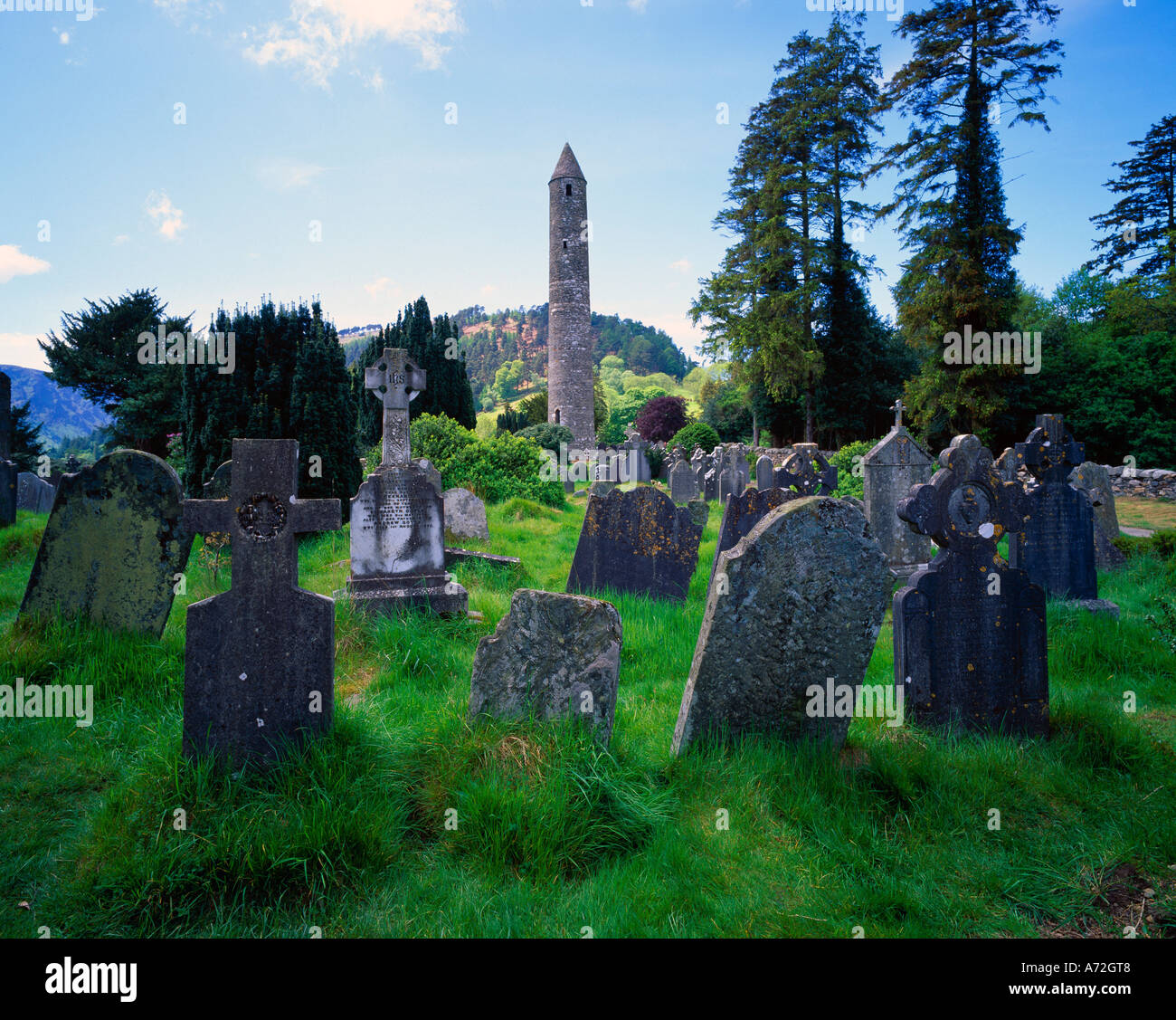 Old gravestones and tower of St Kevin s Church historic Glendalough ...