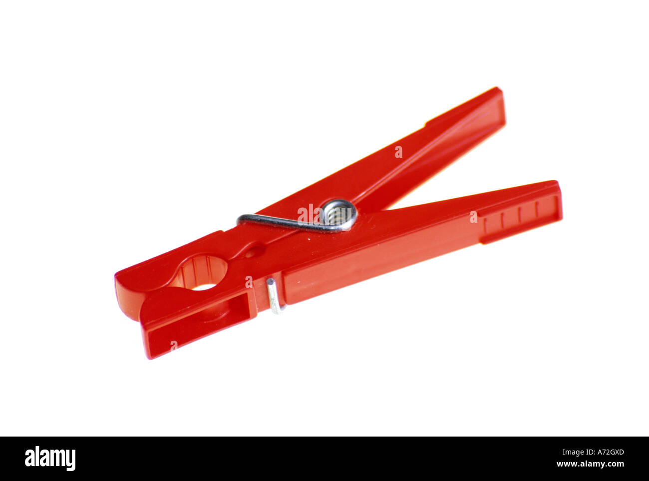 Red plastic clothes peg on white background Stock Photo - Alamy