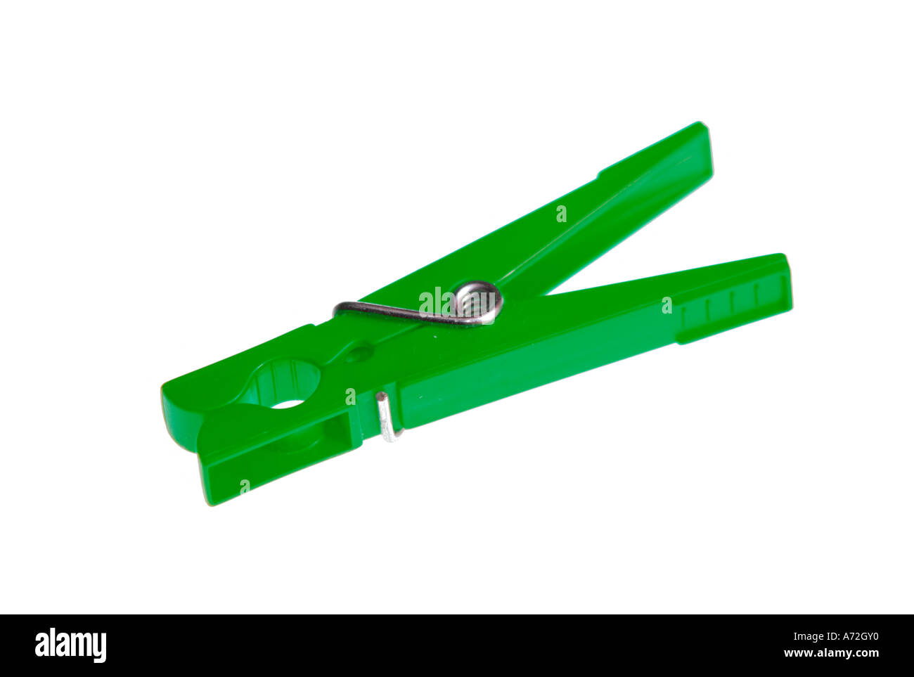 Green plastic clothes peg on white background Stock Photo - Alamy
