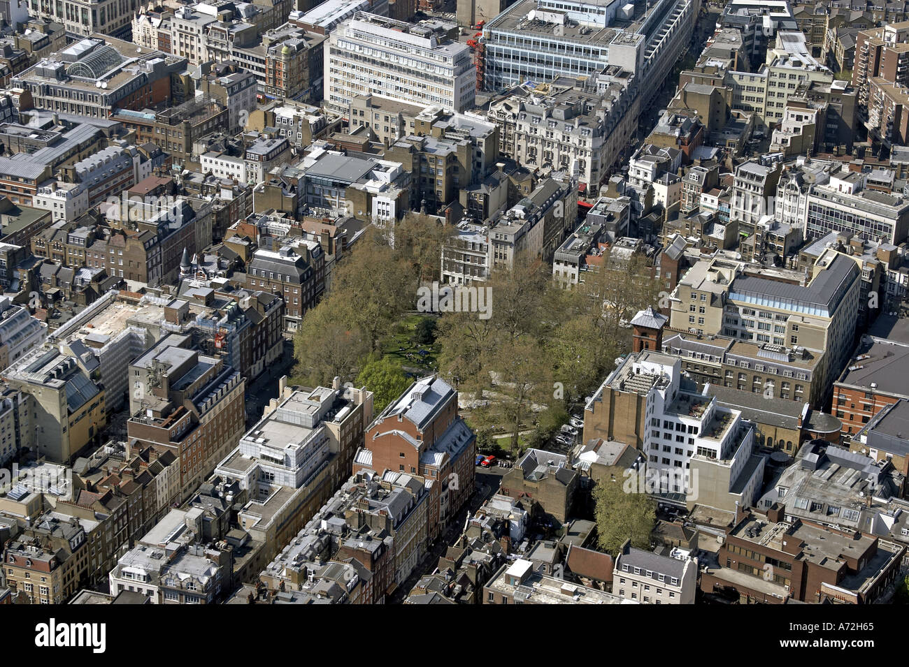 Aerial high level oblique view north east of Soho Square Central London ...