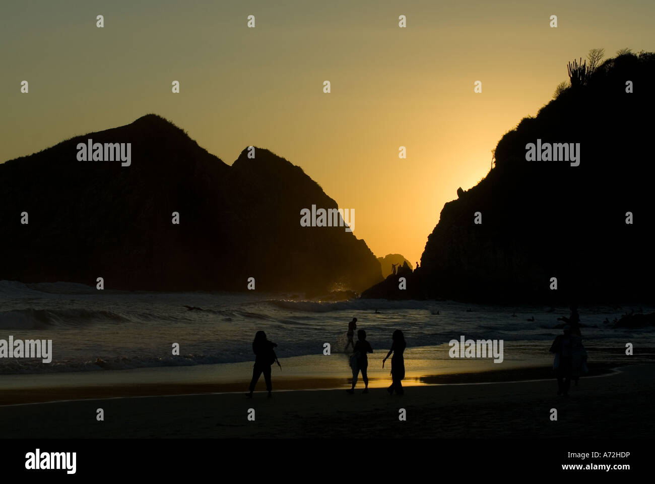Zipolite - men walks on the sand at sunset - Oaxaca - Mexico Stock ...