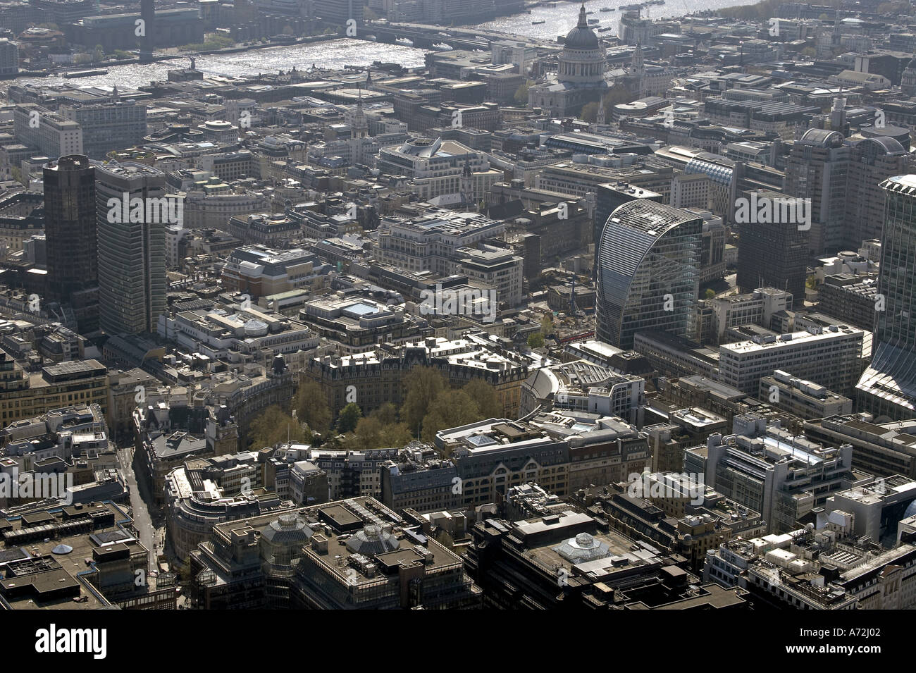 Aerial high level oblique view south west of City of London buildings ...