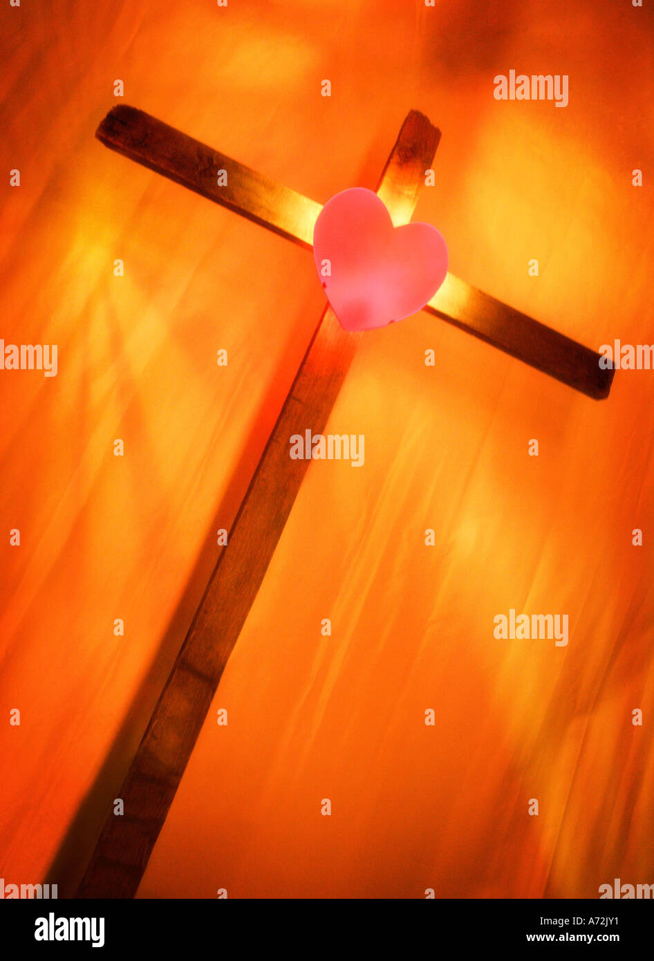 Heart on cross Stock Photo - Alamy