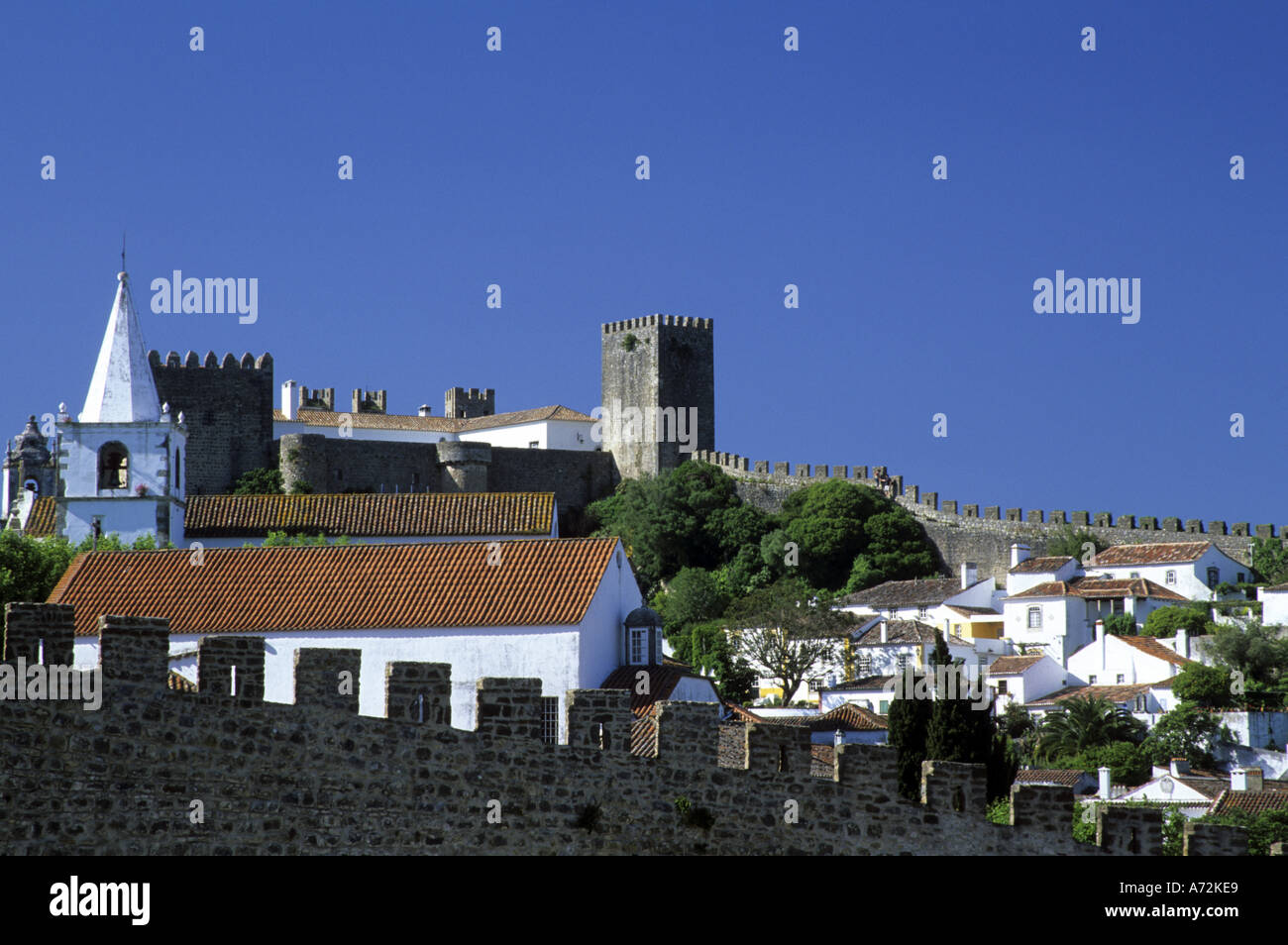 Europe, Portugal, Obidos. Elevated view of whitewashed houses and 14th ...