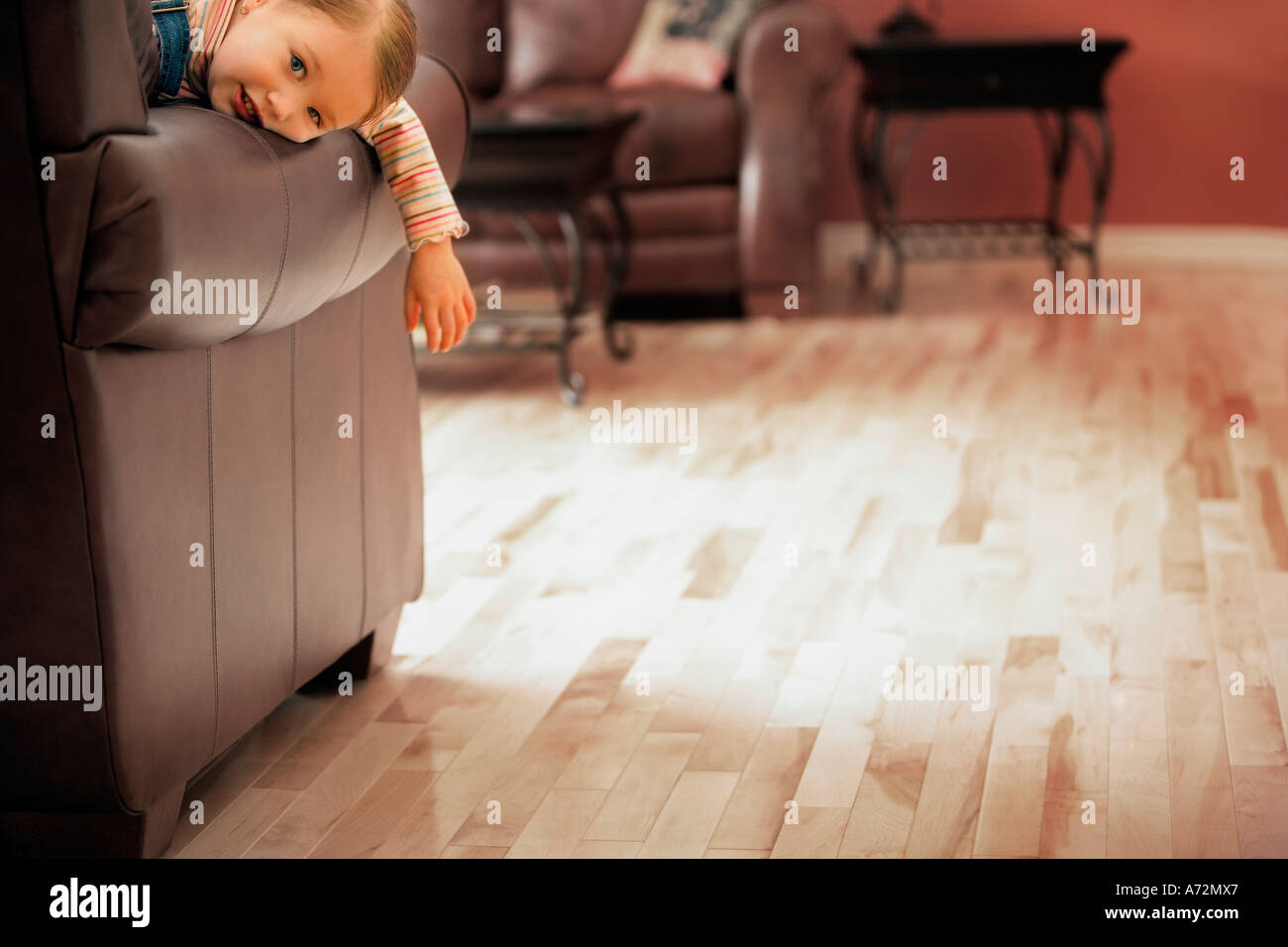 Child laying around on sofa Stock Photo - Alamy