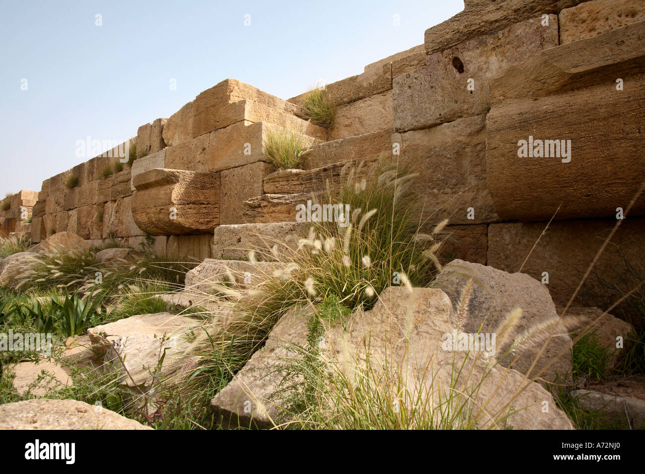 Steps up from the now silted up harbour onto the wharves at Leptis ...
