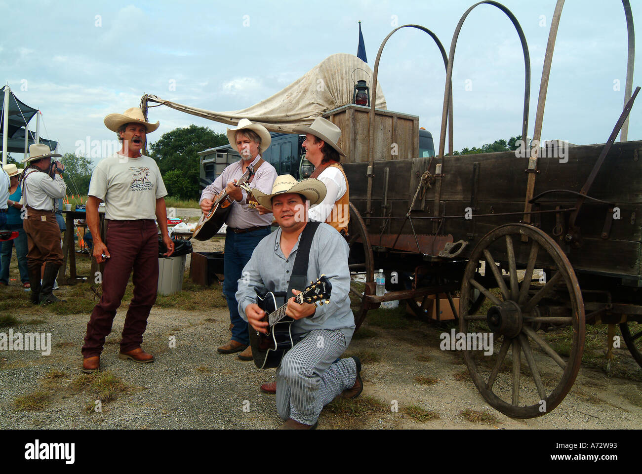 Cowboy singers playing guitar Stock Photo - Alamy