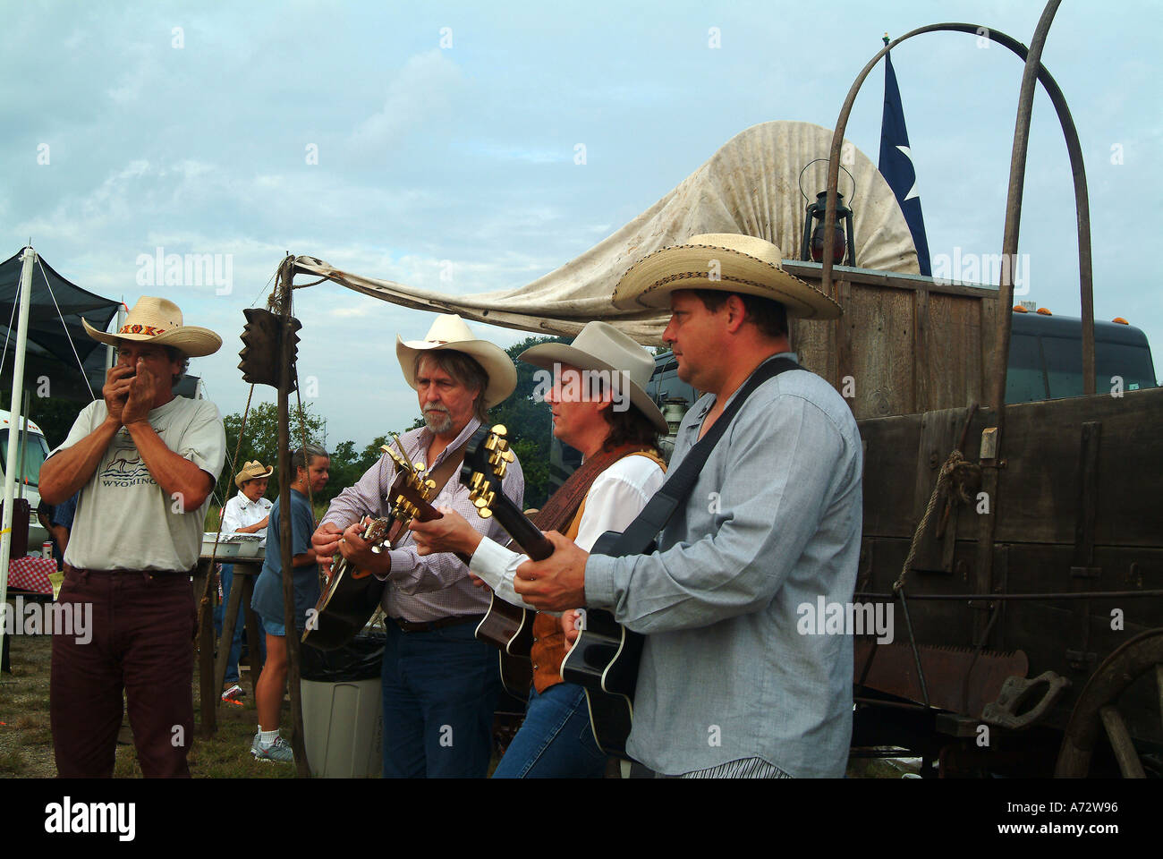 Cowboy singers playing guitar Stock Photo - Alamy