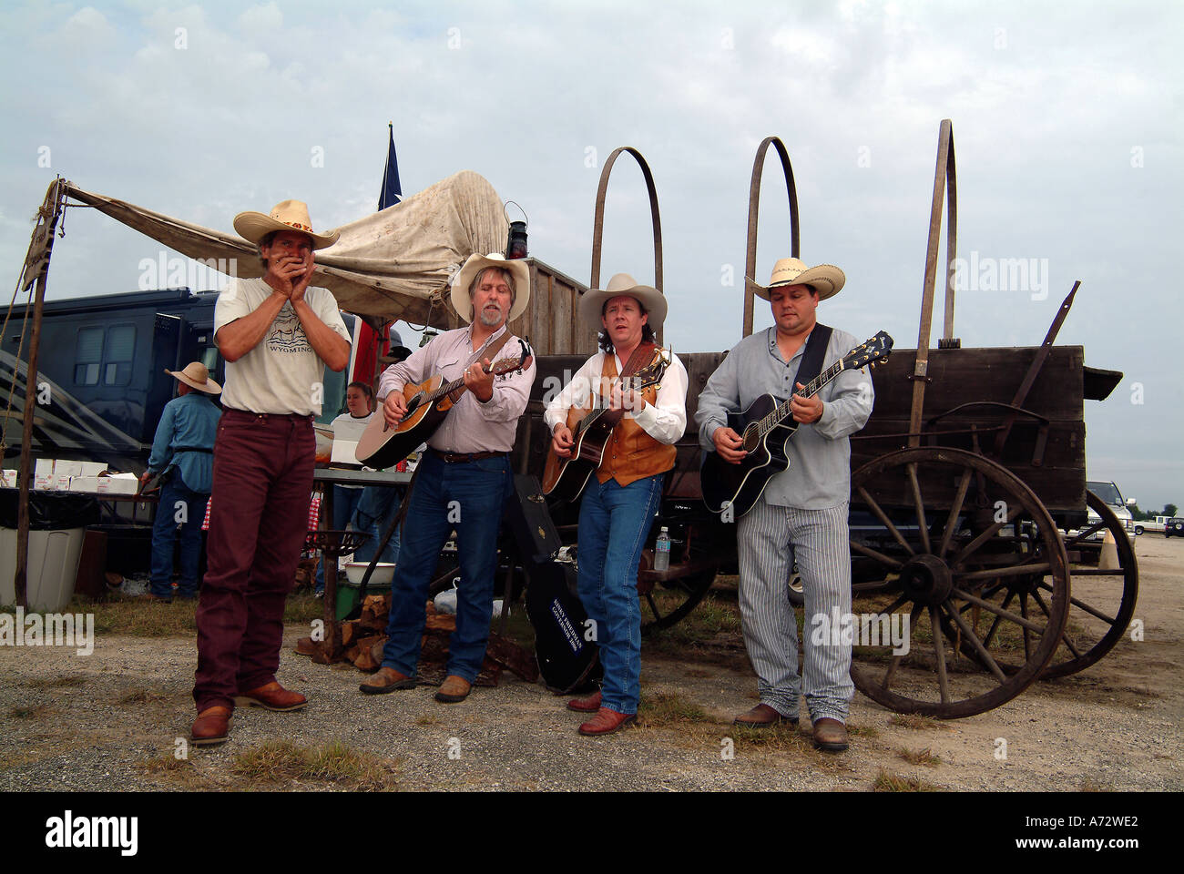 Cowboy singers playing guitar Stock Photo - Alamy