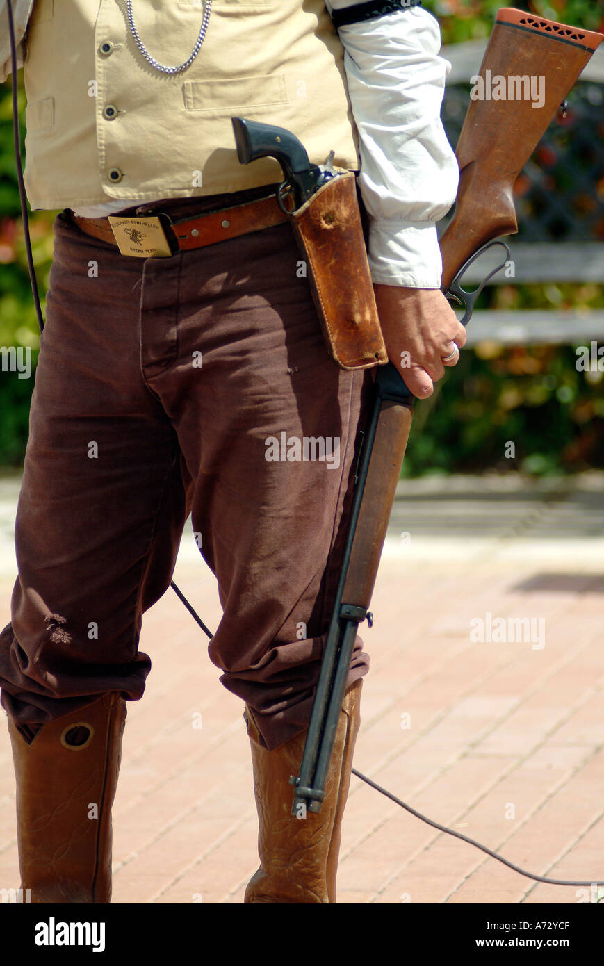 A man acting a cowboy with gun and weapon Stock Photo - Alamy