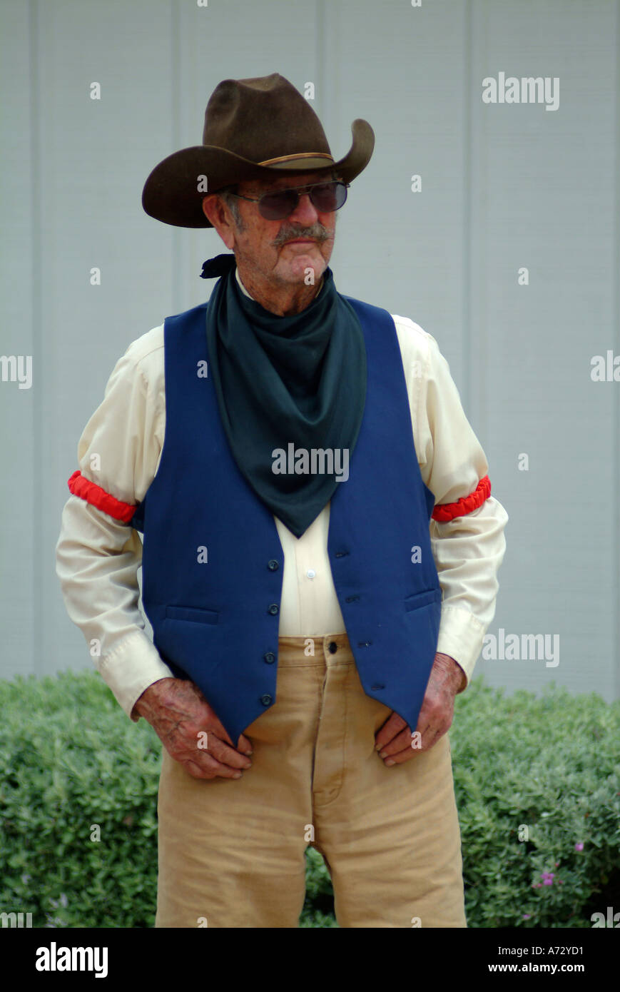 A man acting a cowboy wearing typical clothes Stock Photo - Alamy