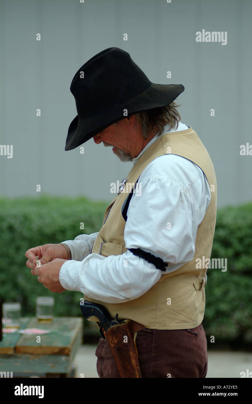 A man acting a cowboy wearing typical clothes Stock Photo - Alamy