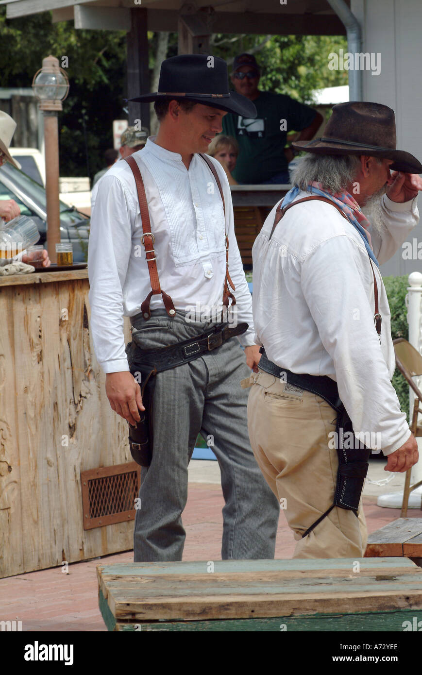 two men acting cowboys wearing typical clothes Stock Photo - Alamy
