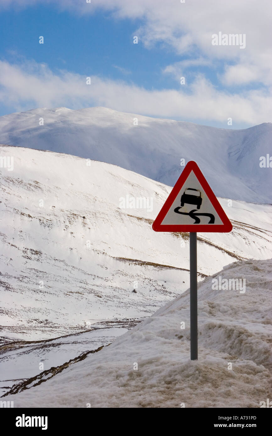 Warning Traffic Sign Slippery road ahead & frozen surfaces with of ...