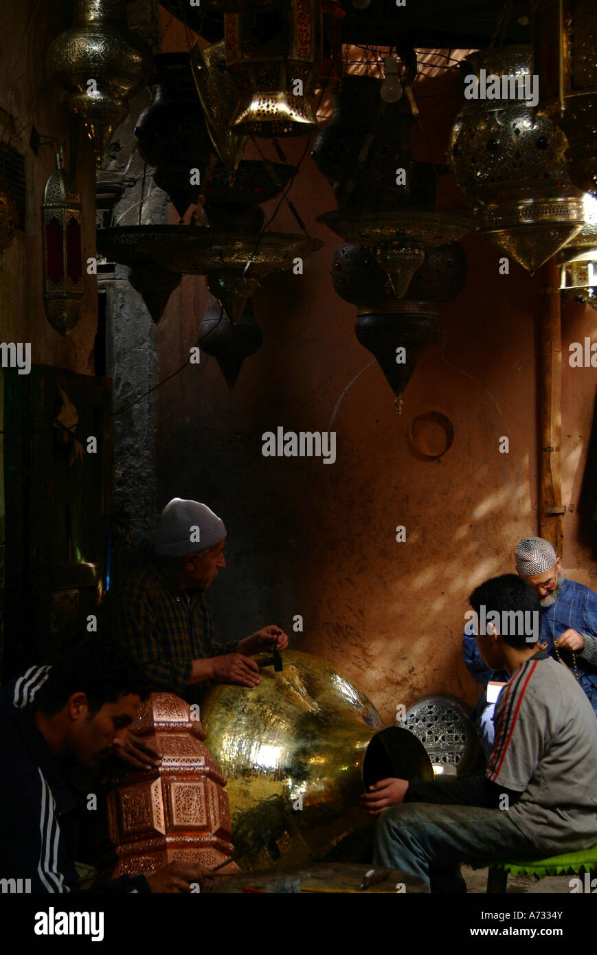 Metal workers making traditional lamps in souks of Marrakesh, Morocco ...
