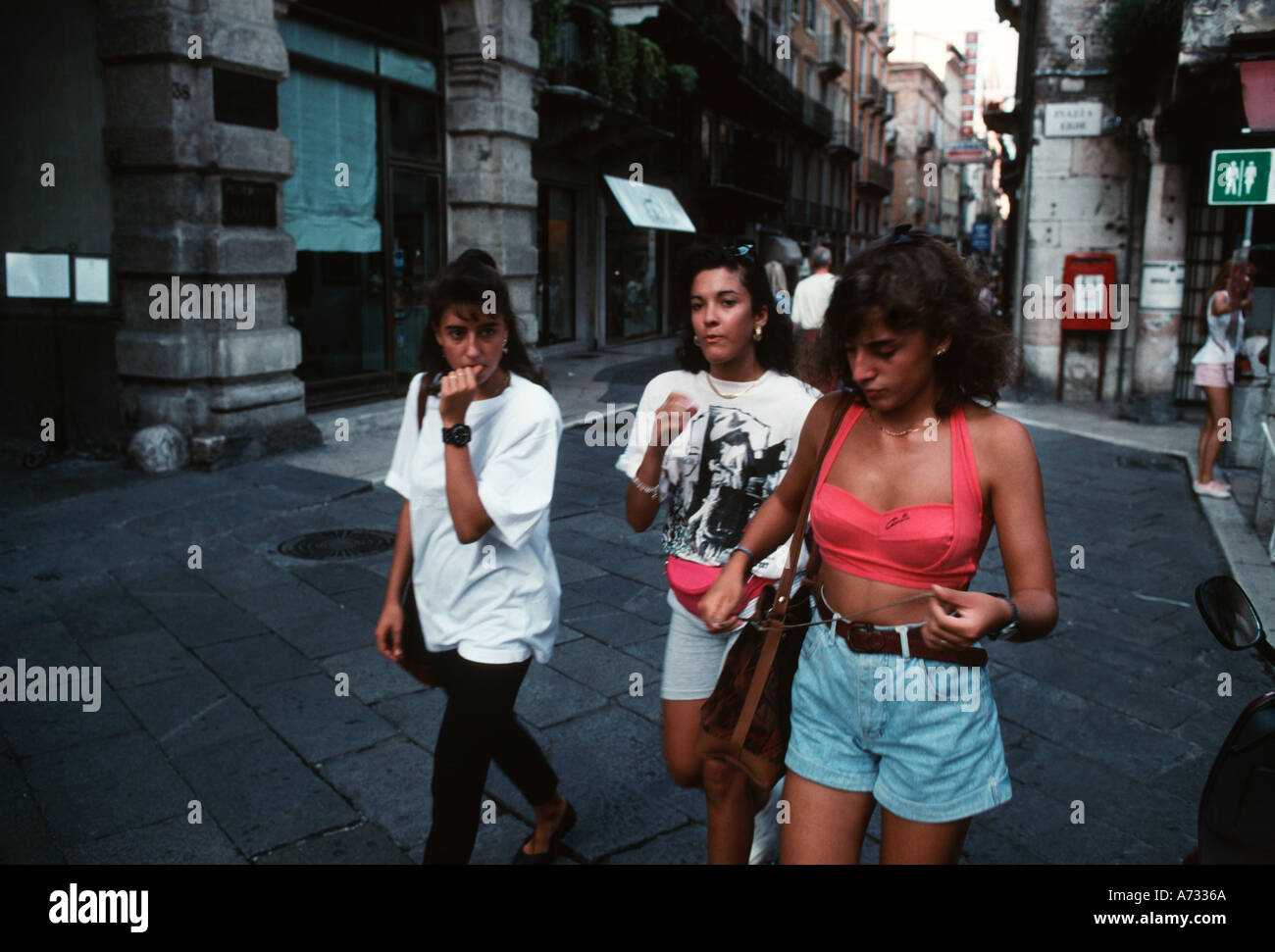 Three girls in an Italian town Stock Photo - Alamy