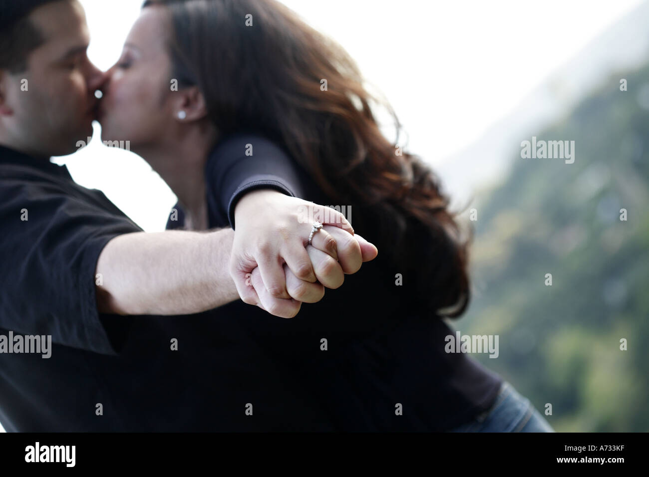 Kissing couple engagement natural hi-res stock photography and images ...