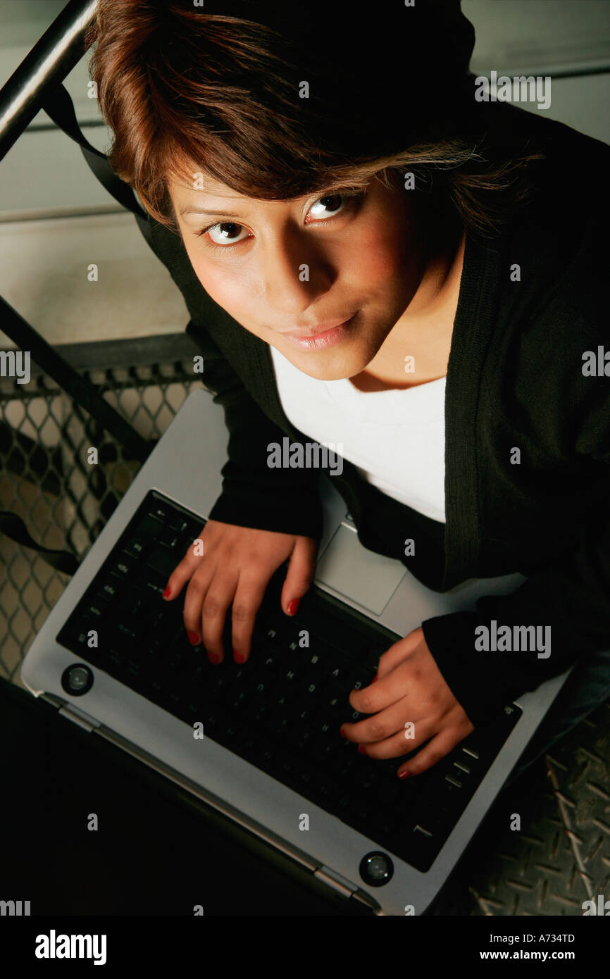 Young adult using a laptop computer Stock Photo - Alamy
