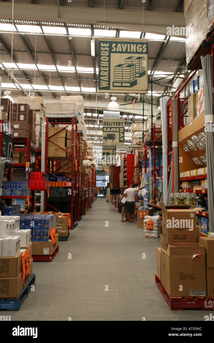 Aisle in a warehouse hardware store with goods on shelves and in boxes ...
