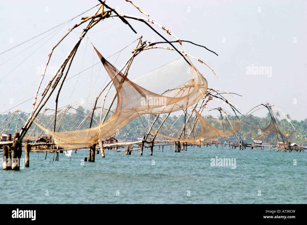 Traditional Chinese fishing nets spread like Preying Mantis over the ...