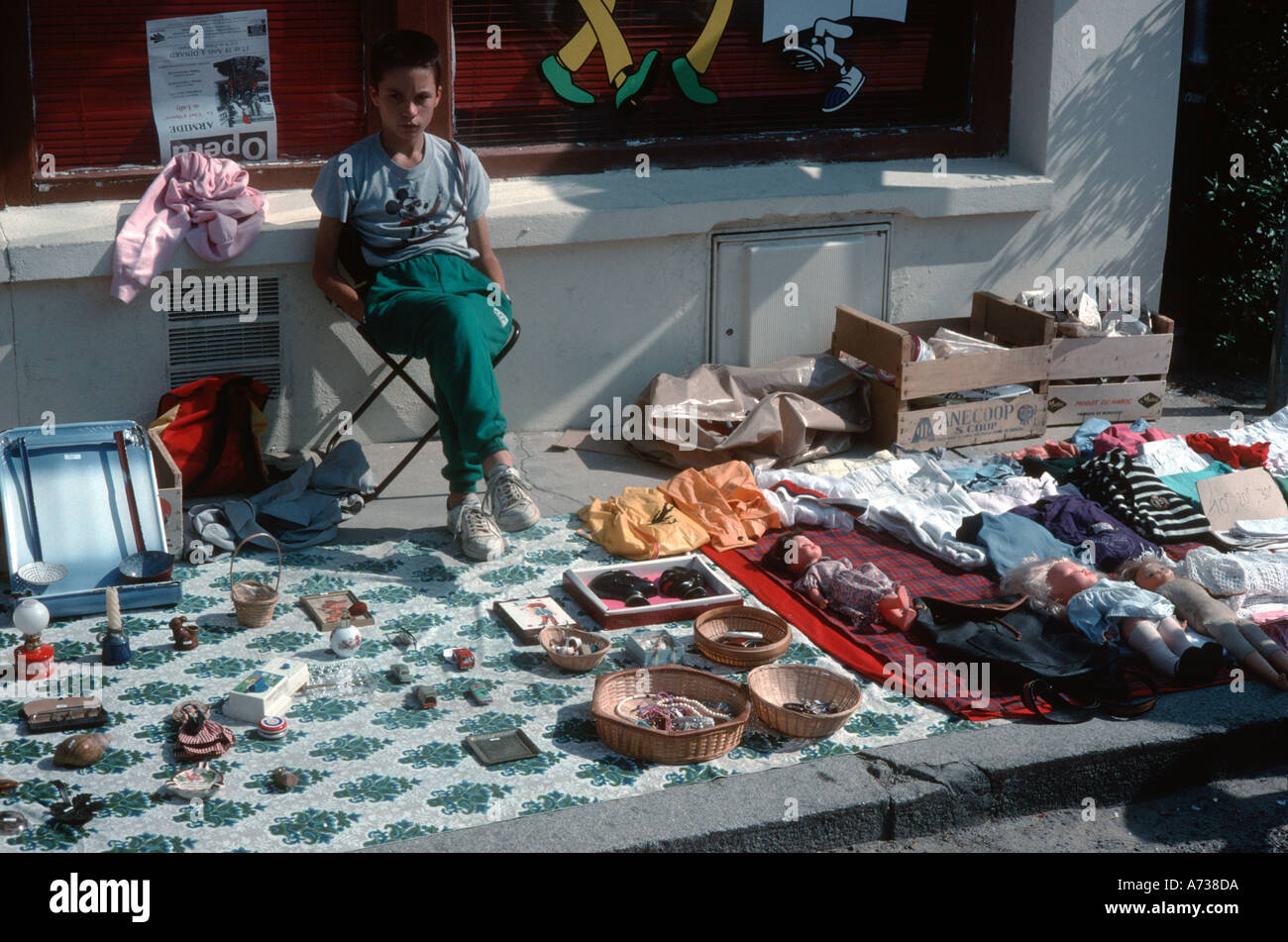 Street trader young boy flea market pavement sidewalk Stock Photo - Alamy