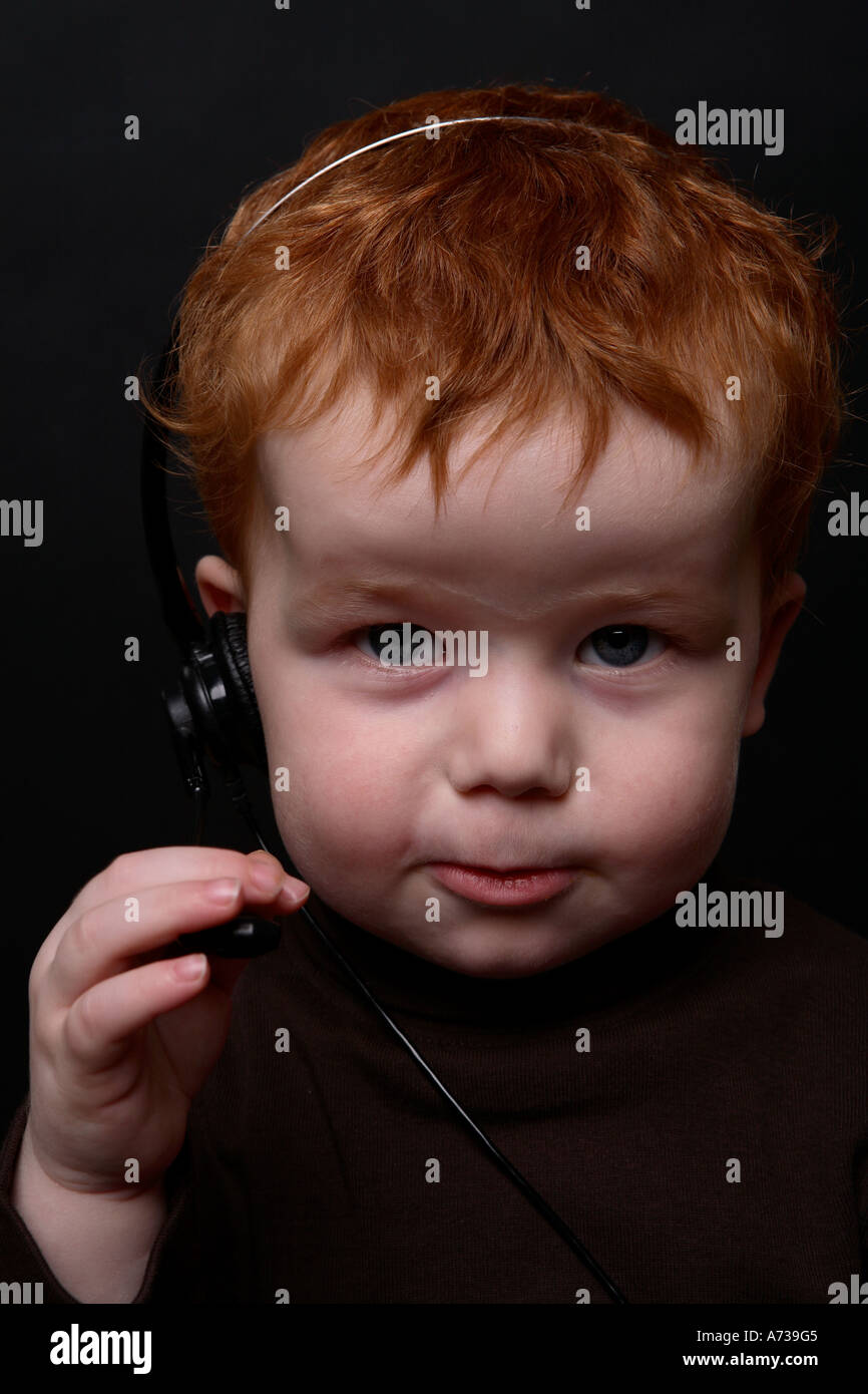 Child wearing telephone headset Stock Photo - Alamy