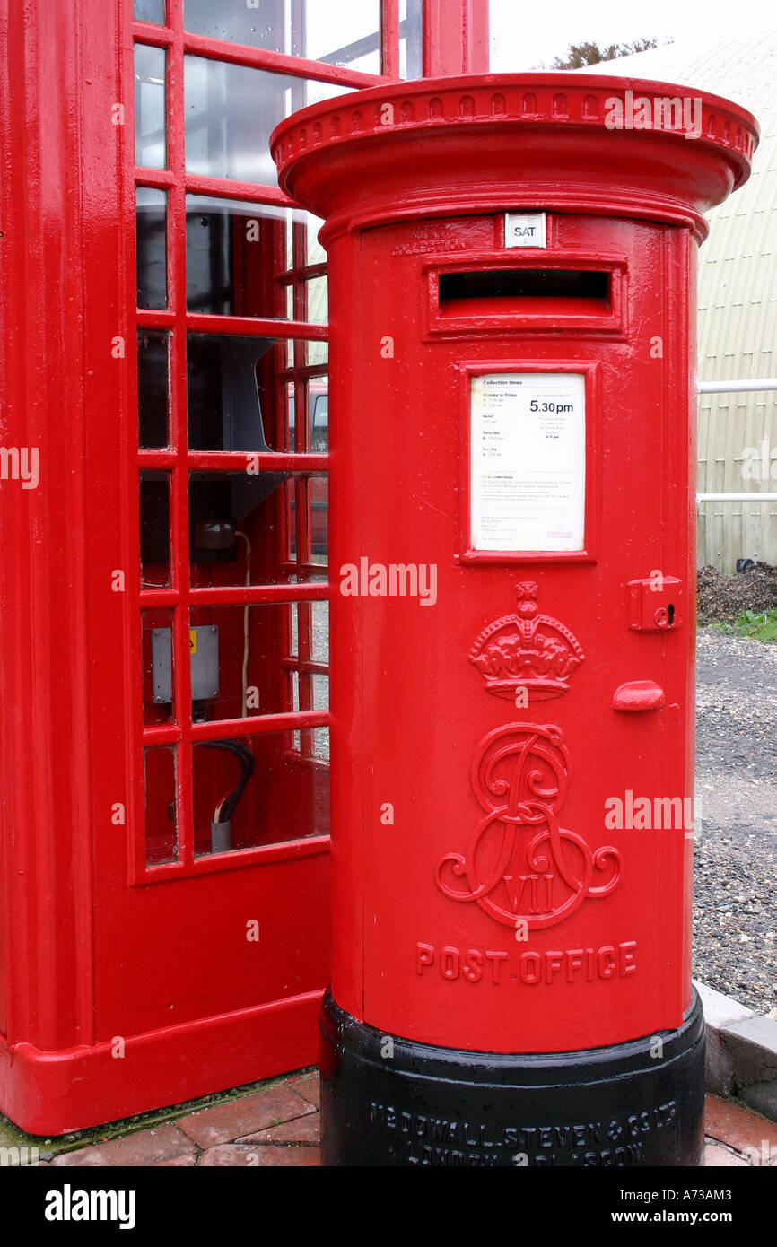 British red post box, with telephone box in background Stock Photo - Alamy
