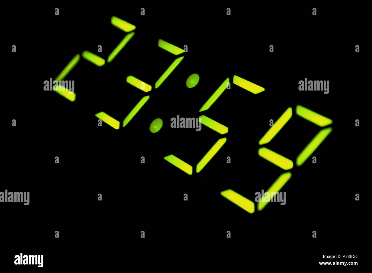 One minute to midnight on a digital clock Stock Photo - Alamy