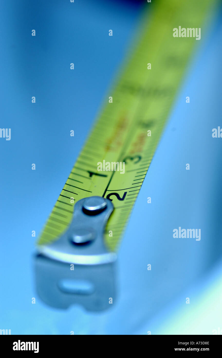 Extended yellow measuring tape Stock Photo - Alamy