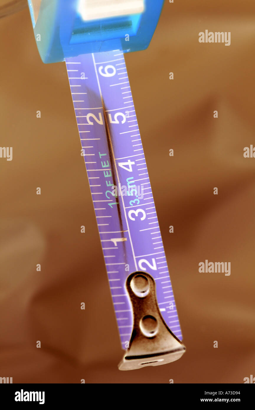 Extended yellow measuring tape Stock Photo - Alamy