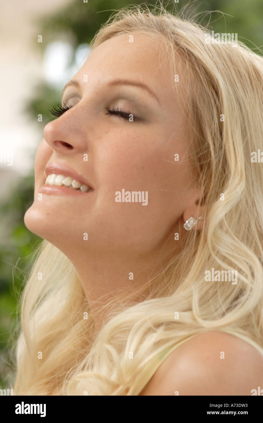 Turning the face in the sun Stock Photo - Alamy